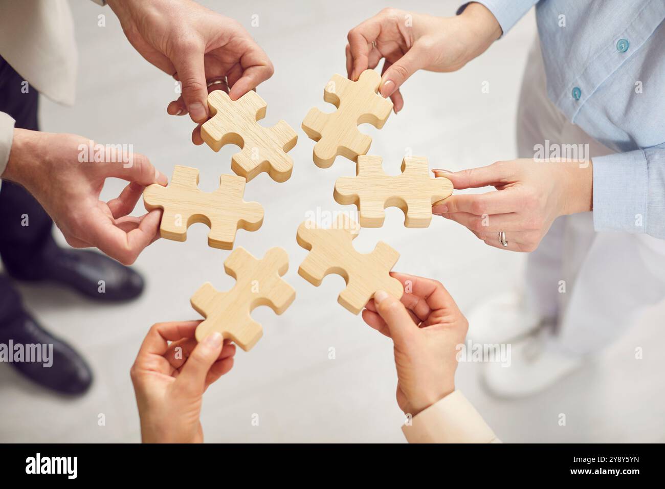 Business People Connecting Wooden Puzzles Together Stock Photo - Alamy