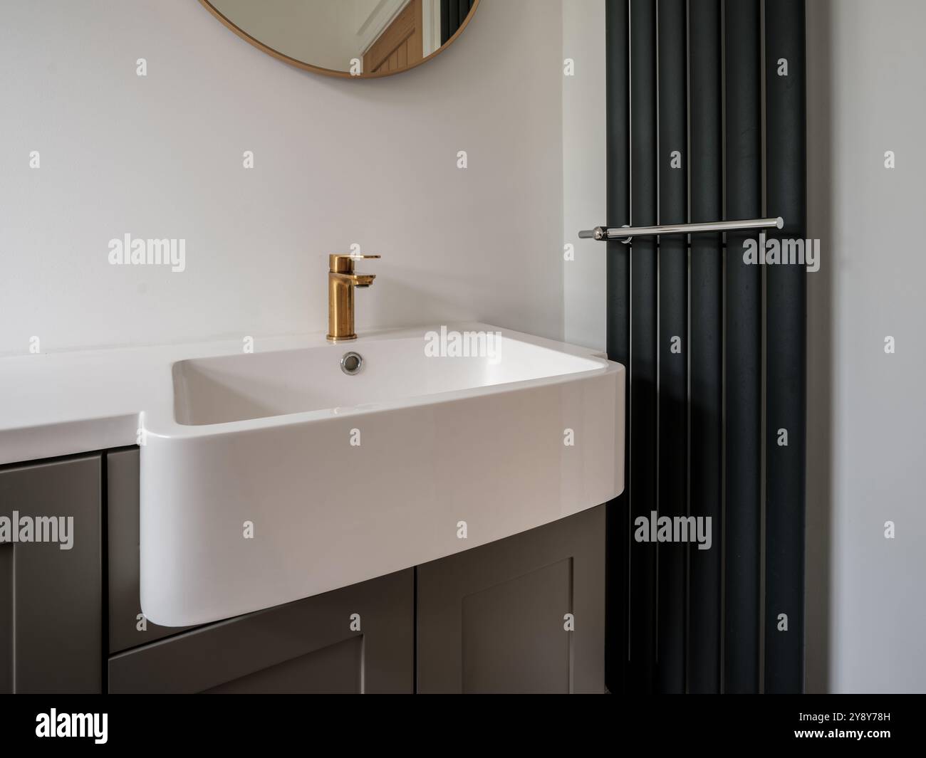 Luxury modern washroom and cloakroom detail with basin and contemporary ...