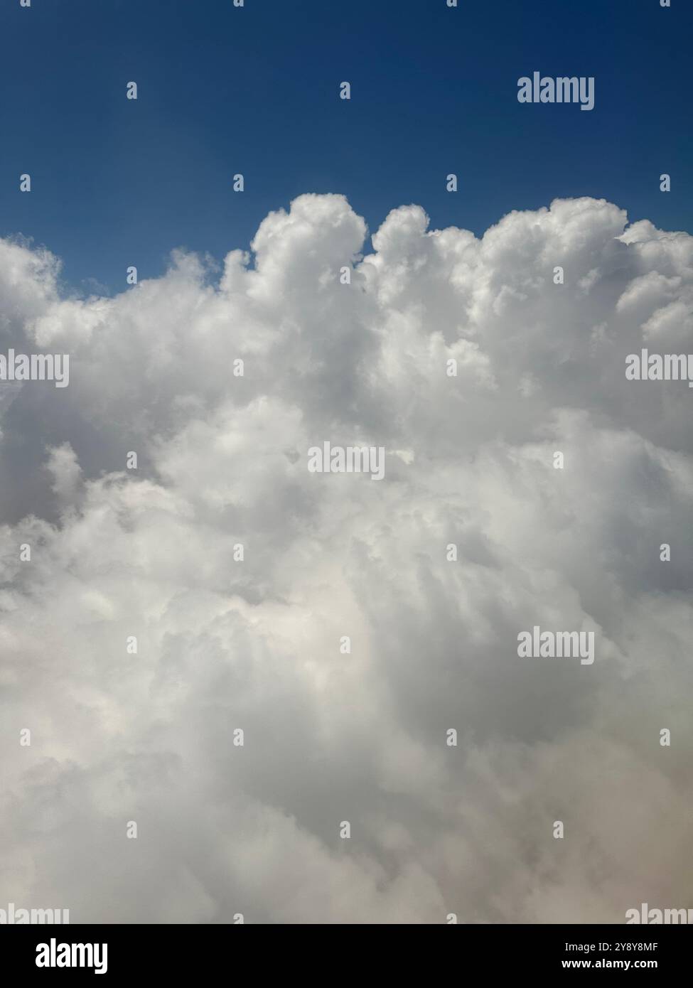 Fluffy clouds in the sky taken from an airplane Stock Photo - Alamy