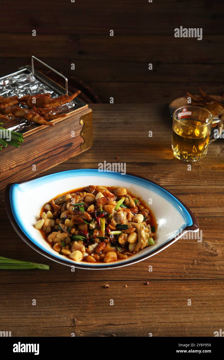 Frog with Pickled Pepper, bullfrog in sour soup Stock Photo - Alamy