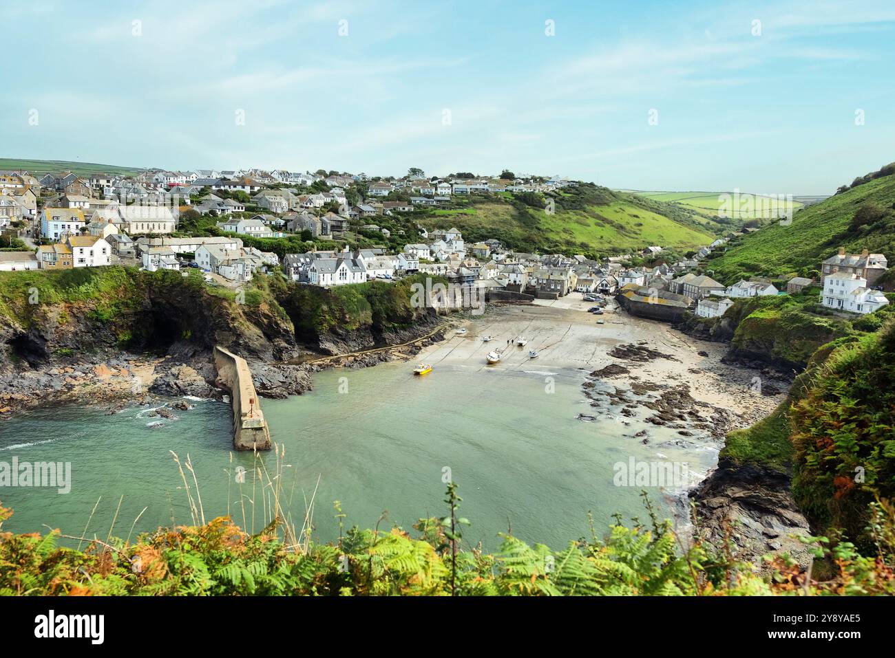 Port Isaac fishing village harbour and sea wall, at low tide, on the ...