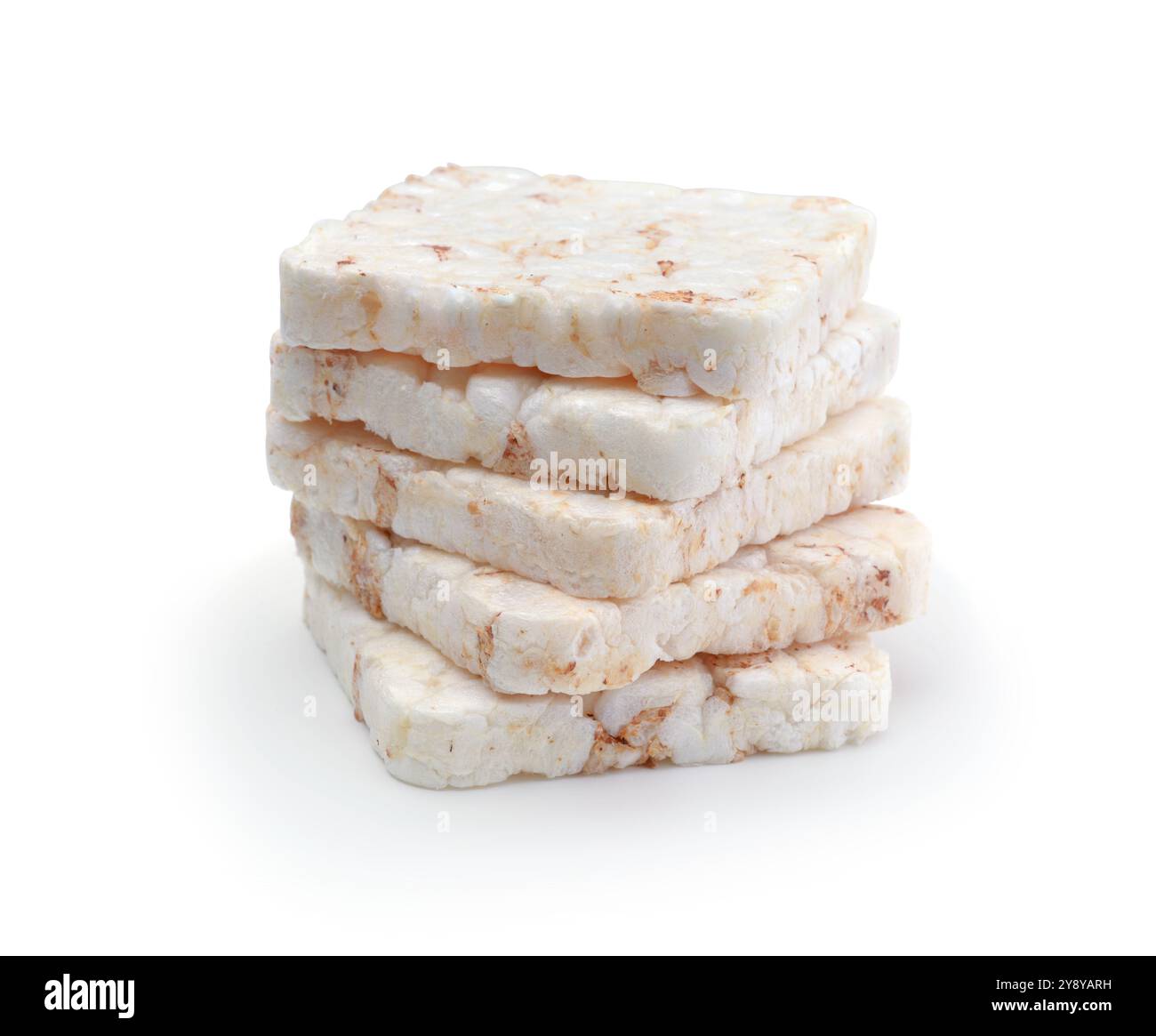 A stack of puffed rice bread isolated on white Stock Photo - Alamy