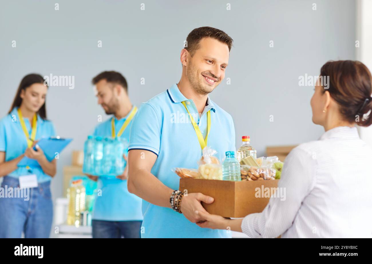 Woman volunteer hold box hi-res stock photography and images - Alamy