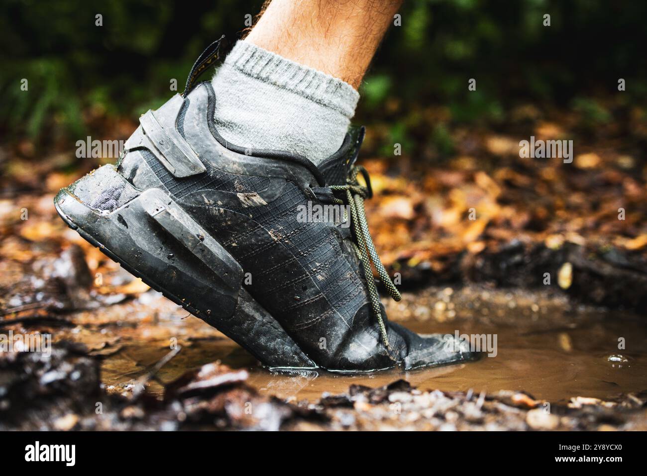 Shoes in puddle hi-res stock photography and images - Alamy
