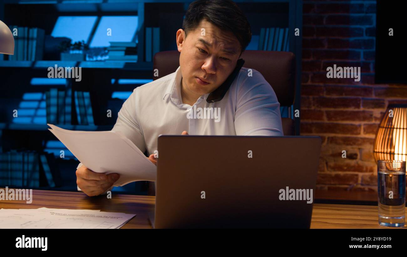 Angry ceo talking smartphone night hi-res stock photography and images ...