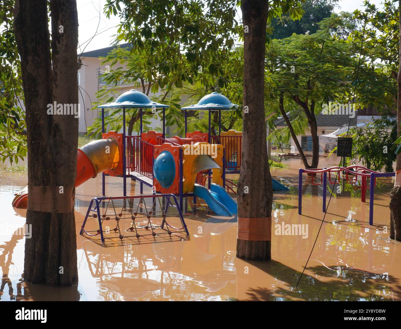 Severe flooding in residential areas in northern Thailand. Playground ...