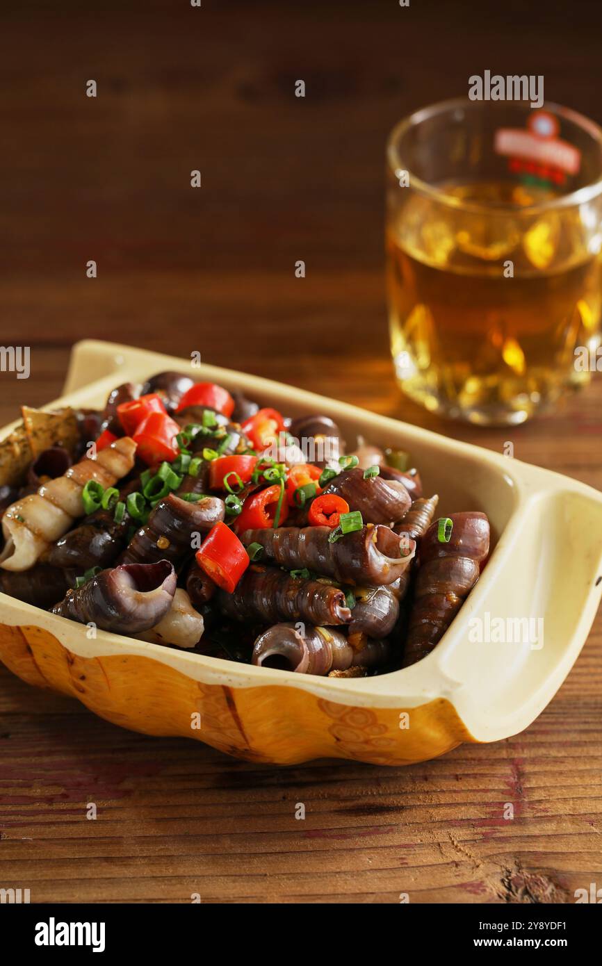 Sautéed(Stir-fried) snails or Whelks（tower snail,turritella mollusk ...