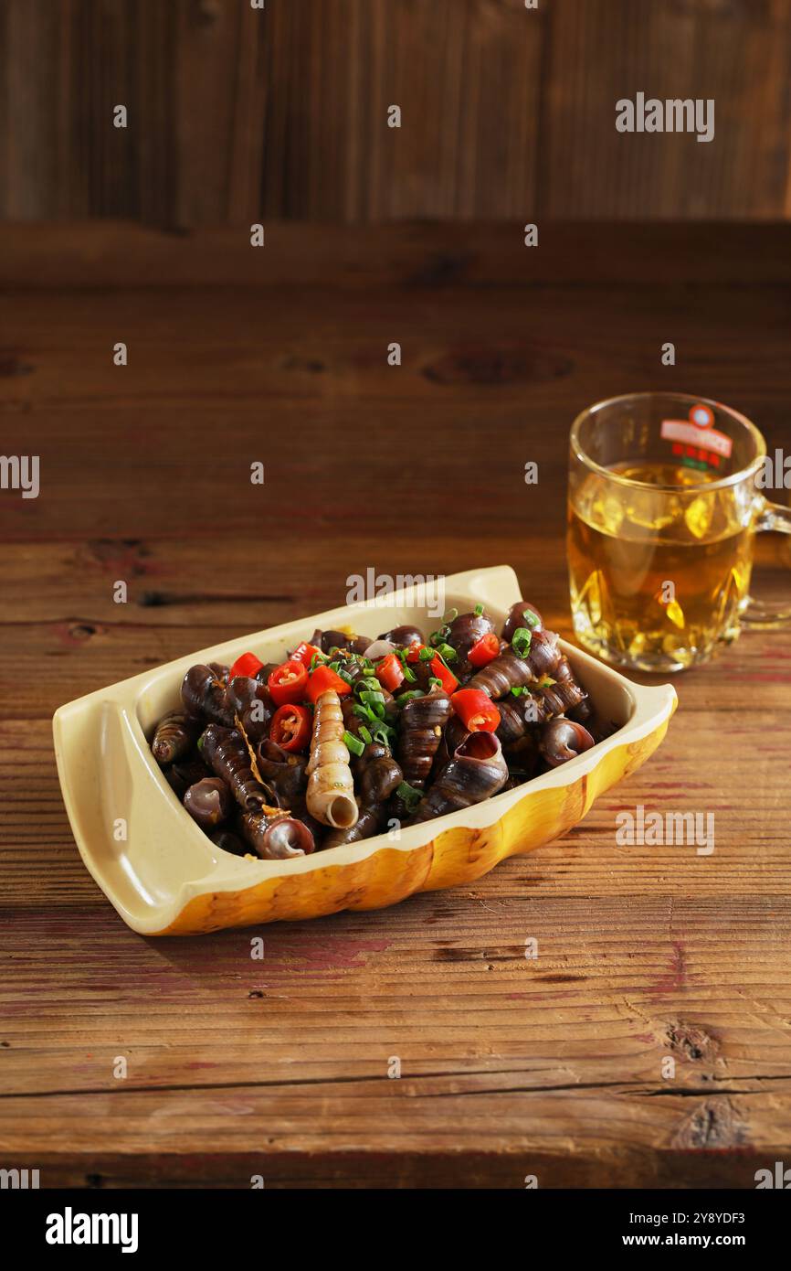 Sautéed(Stir-fried) snails or Whelks（tower snail,turritella mollusk ...