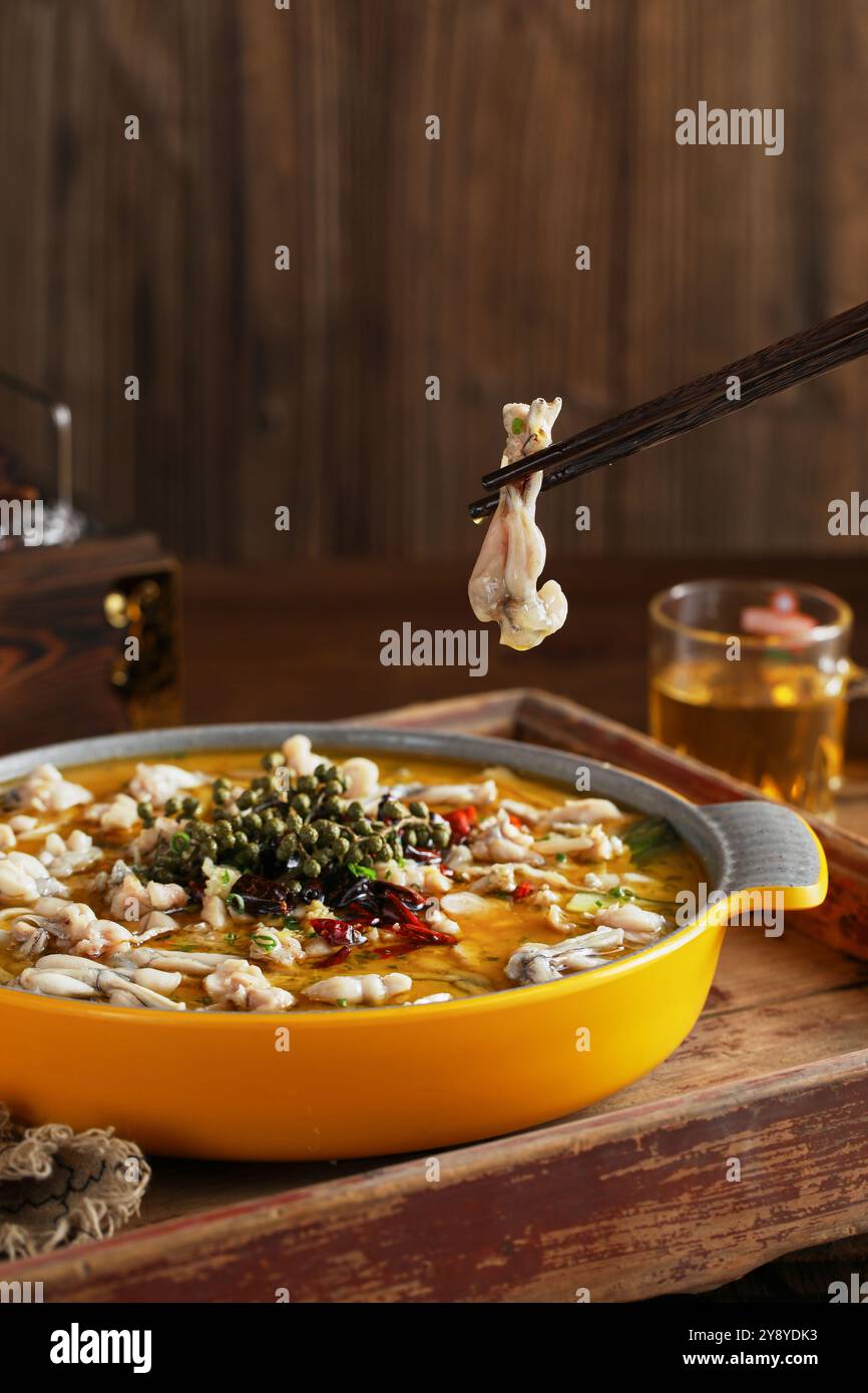 Frog with Pickled Pepper, bullfrog in sour soup Stock Photo - Alamy