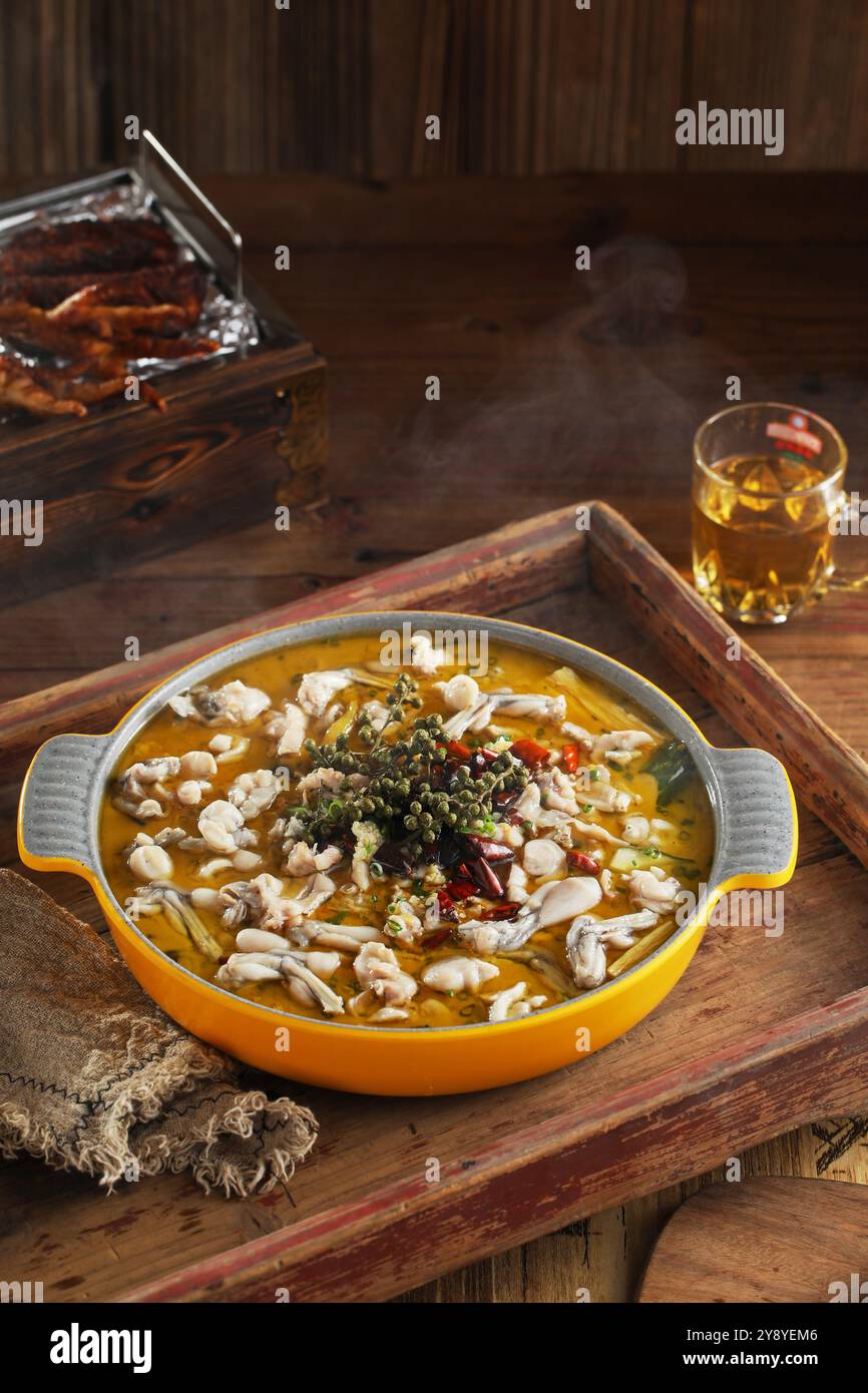 Frog with Pickled Pepper, bullfrog in sour soup Stock Photo - Alamy