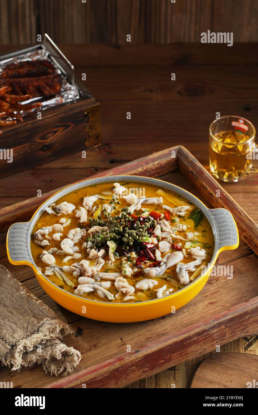 Frog with Pickled Pepper, bullfrog in sour soup Stock Photo - Alamy
