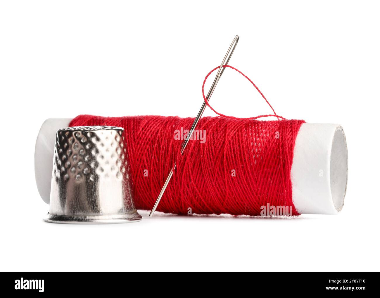 Thimble and needle with red sewing thread isolated on white Stock Photo ...