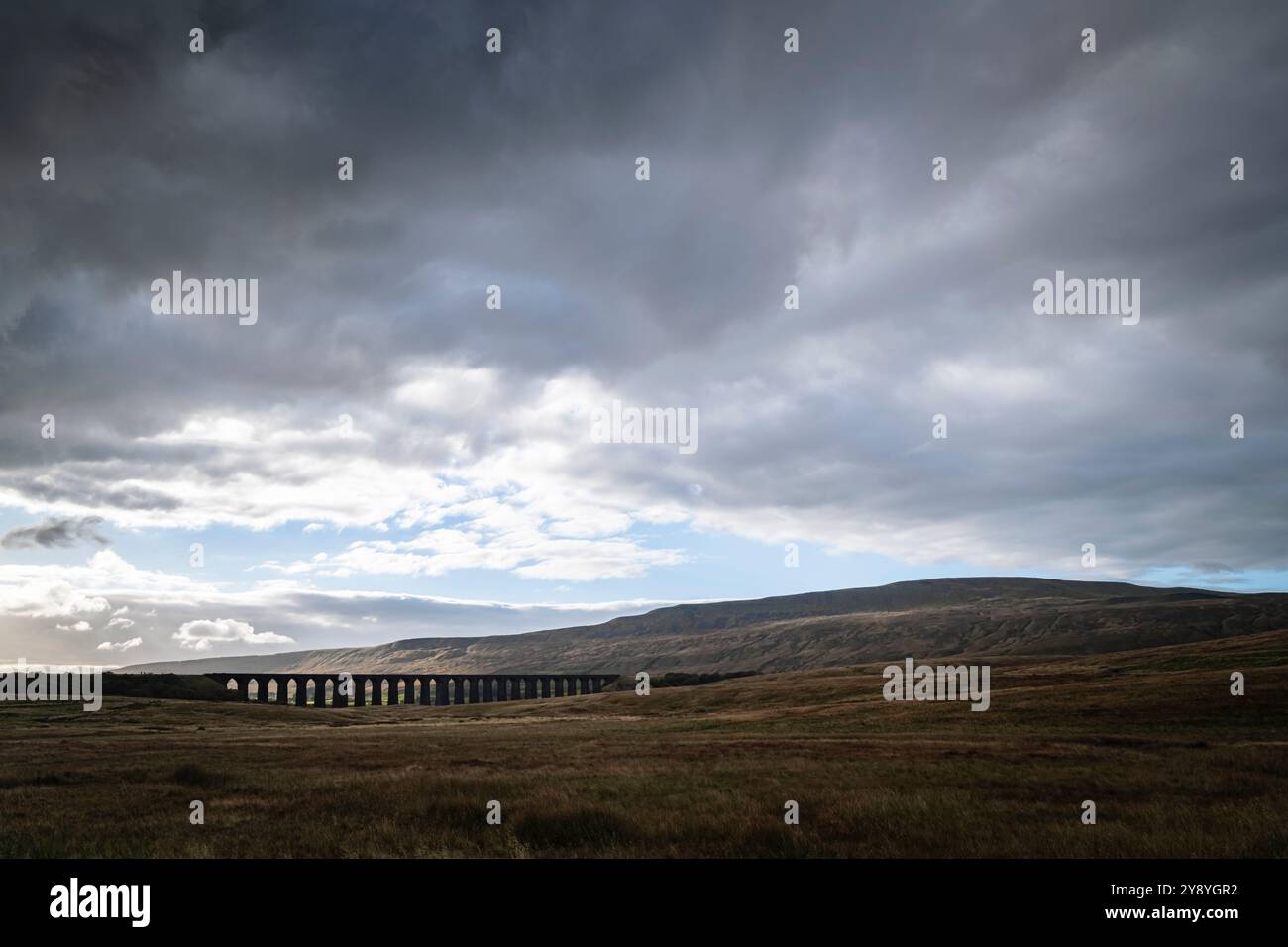 A gloomy, autumnal HDR image of all 24 arches of the Ribblehead Viaduct ...
