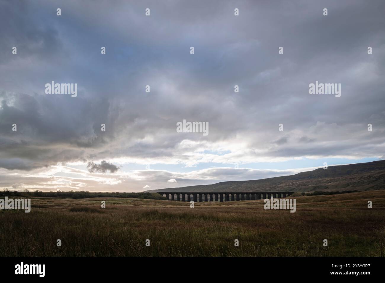 A gloomy, autumnal HDR image of all 24 arches of the Ribblehead Viaduct ...