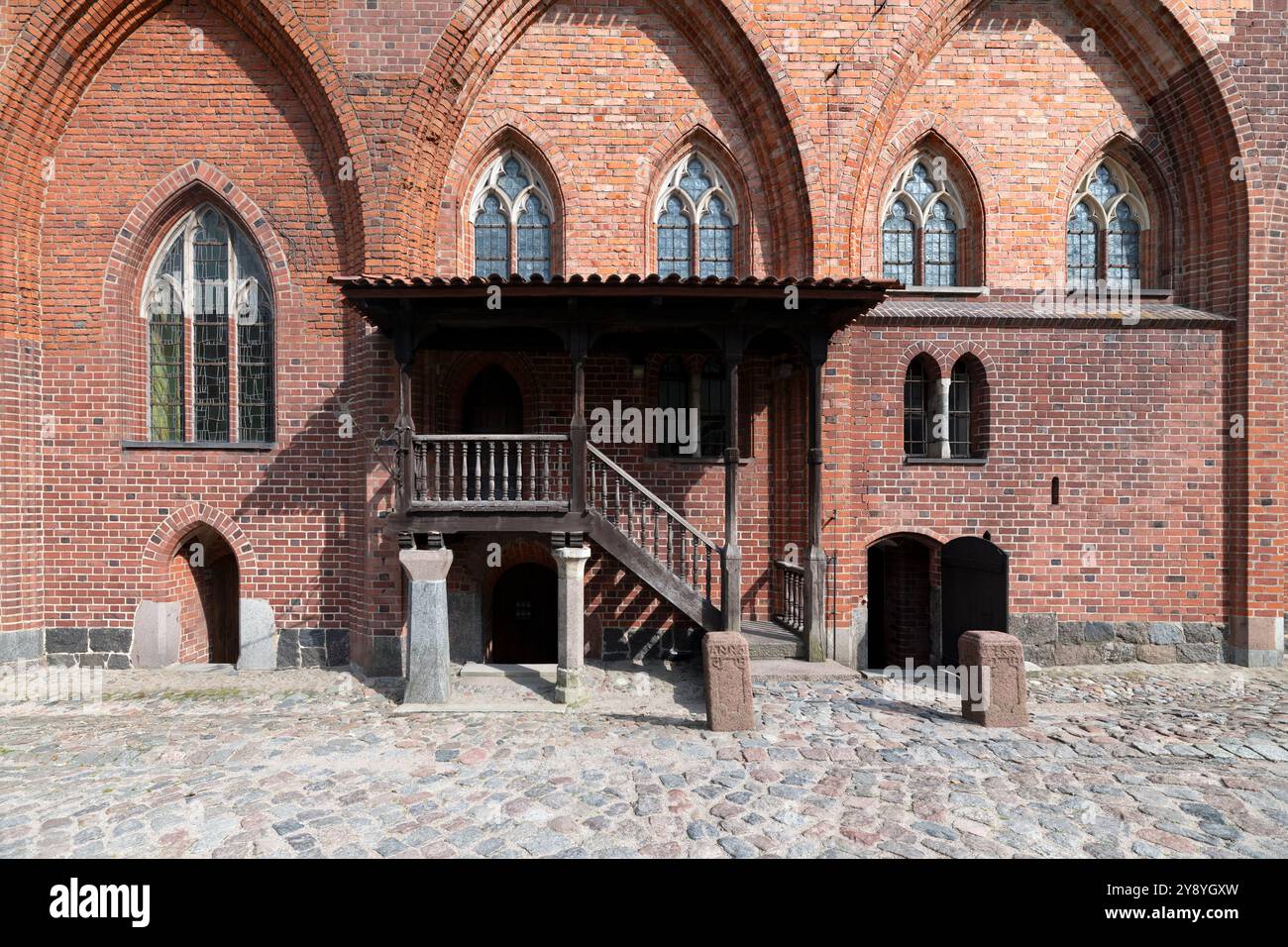 Elevated entrance to medieval structure shaded by red tile awning Stock ...