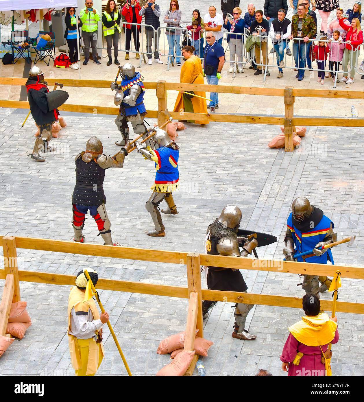Reenactment of medieval knights in armour fighting in traditional ...
