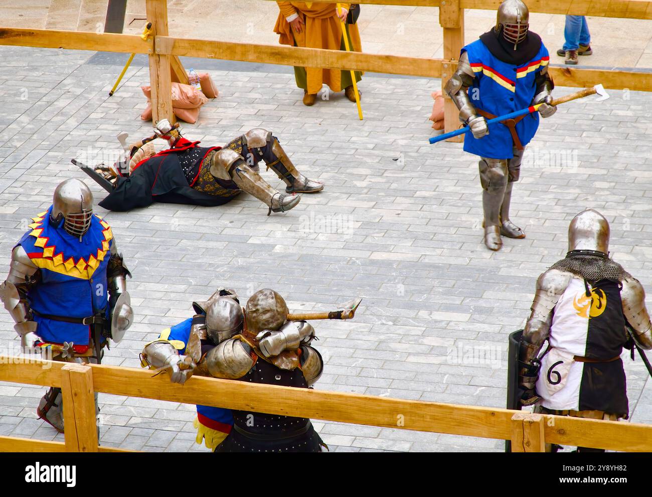 Reenactment of medieval knights in armour fighting in traditional ...
