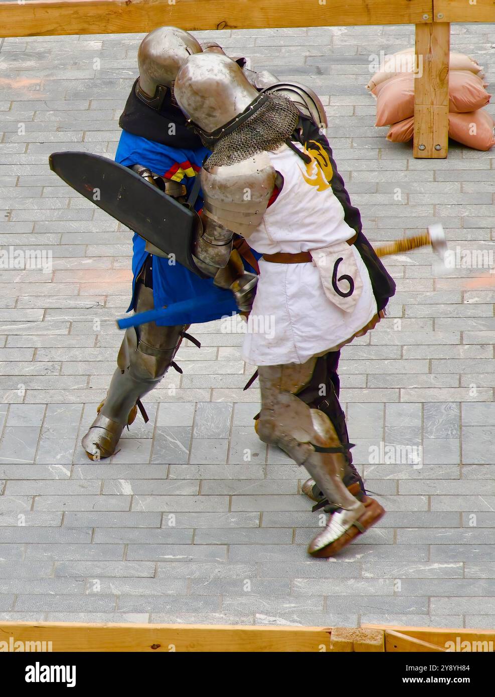 Reenactment of medieval knights in armour fighting in traditional ...