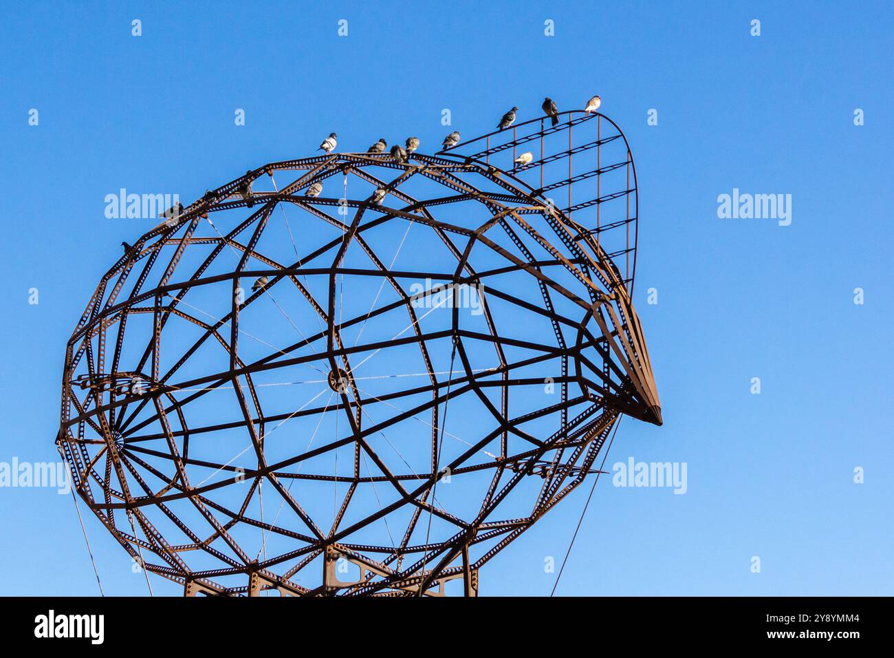 a structure of an iron flying balloon with pigeons on it Stock Photo ...