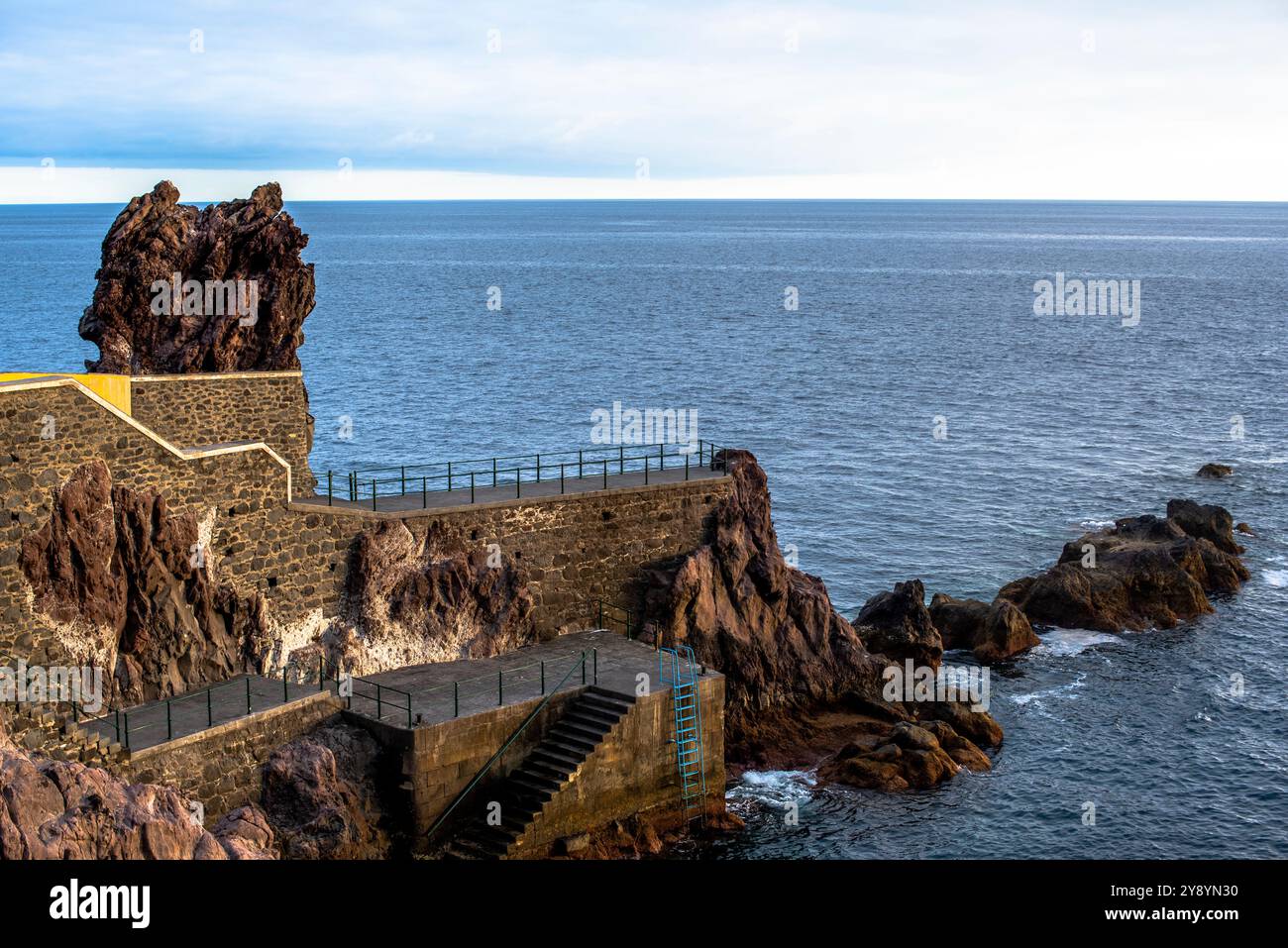 ocean cliff with concrete and stone walls to protect geometries and ...