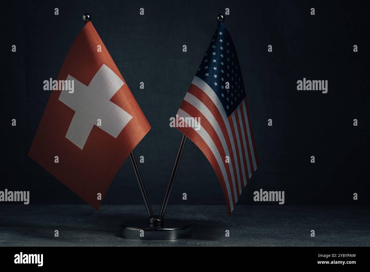Table flags United States America and National Flag Switzerland on dark ...