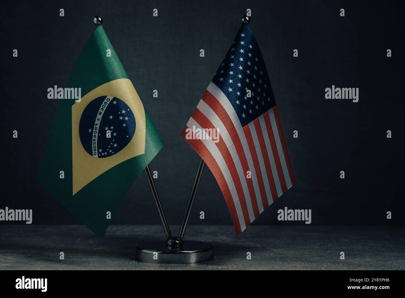 Table flags United States America and National Flag Brazil on dark ...