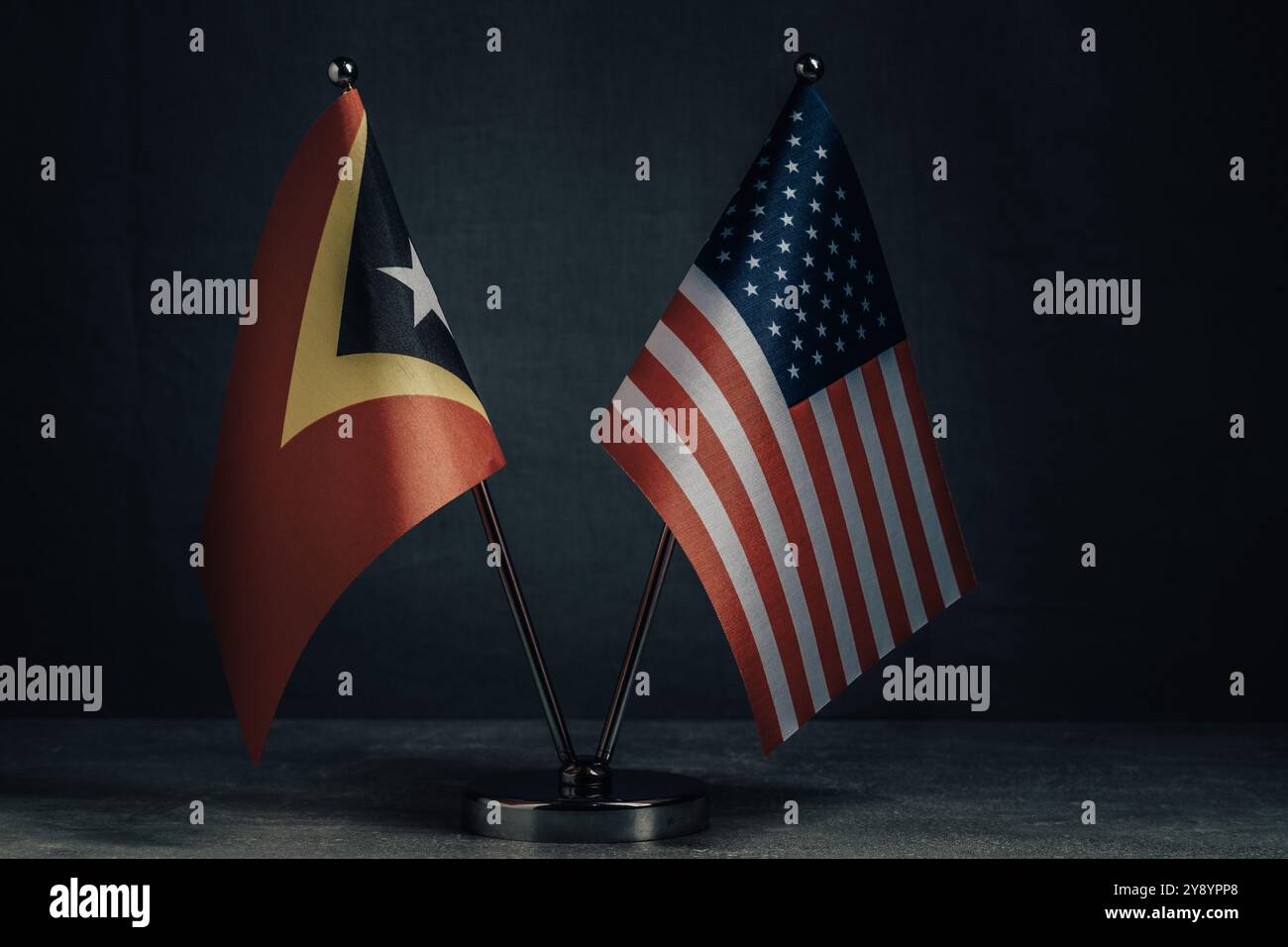 Table flags United States America and National Flag Timor Leste on dark ...