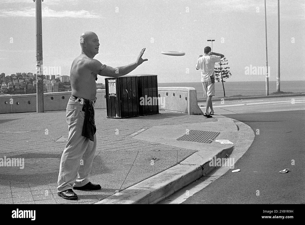 Playing Frisbee, young adults hanging about catching a frisbee ,Bondi ...