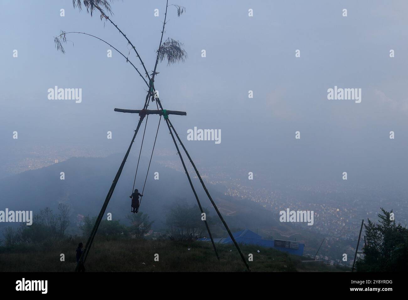 Kathmandu, Nepal. 07th Oct, 2024. People play in a traditional bamboo ...