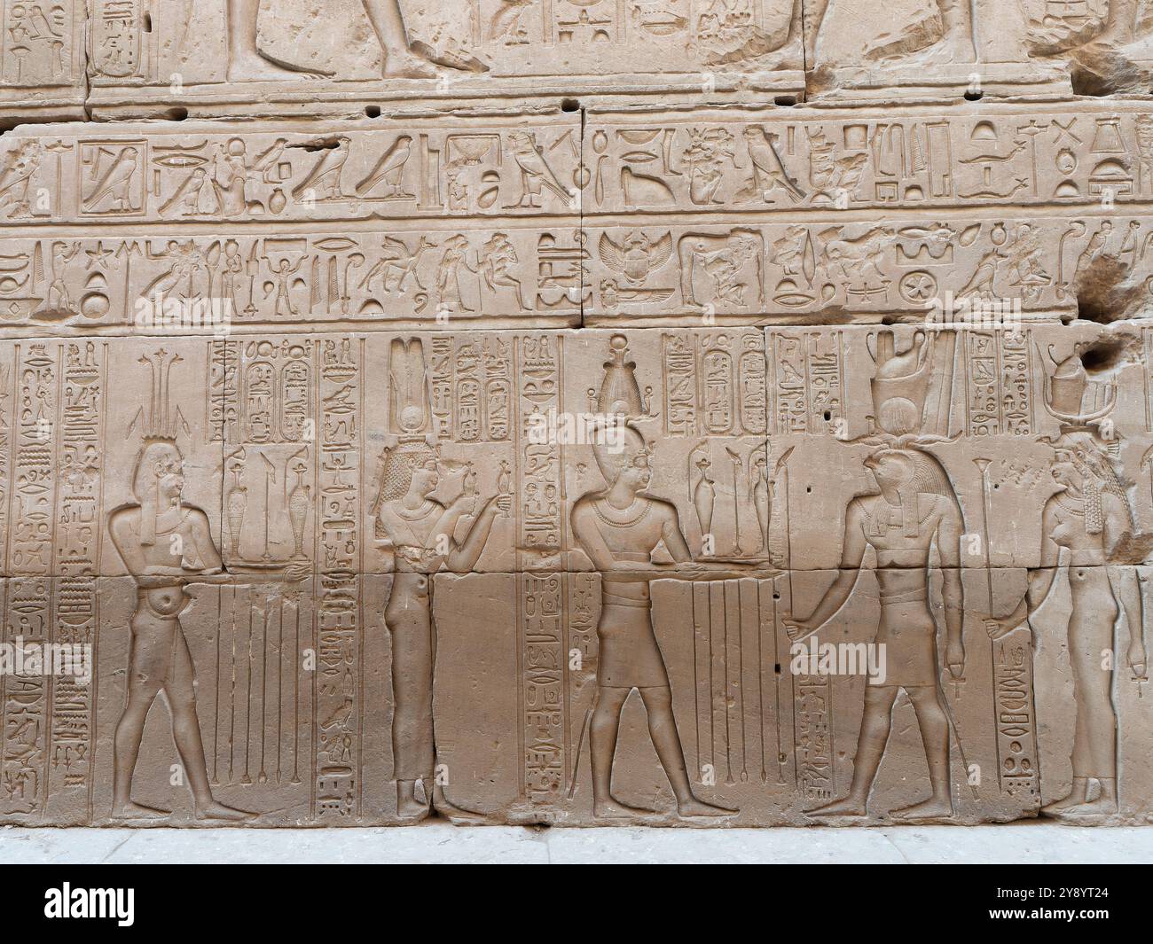 Egyptian hieroglyphic engravings on the stone walls of the temple of ...