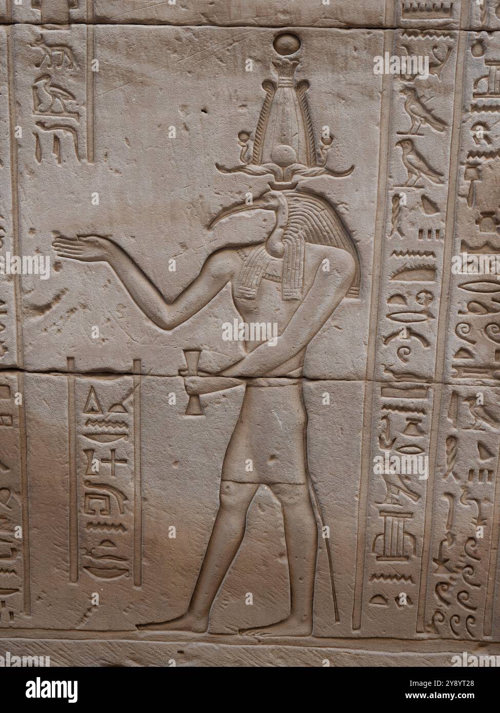 Egyptian hieroglyphic engravings on the stone walls of the temple of ...
