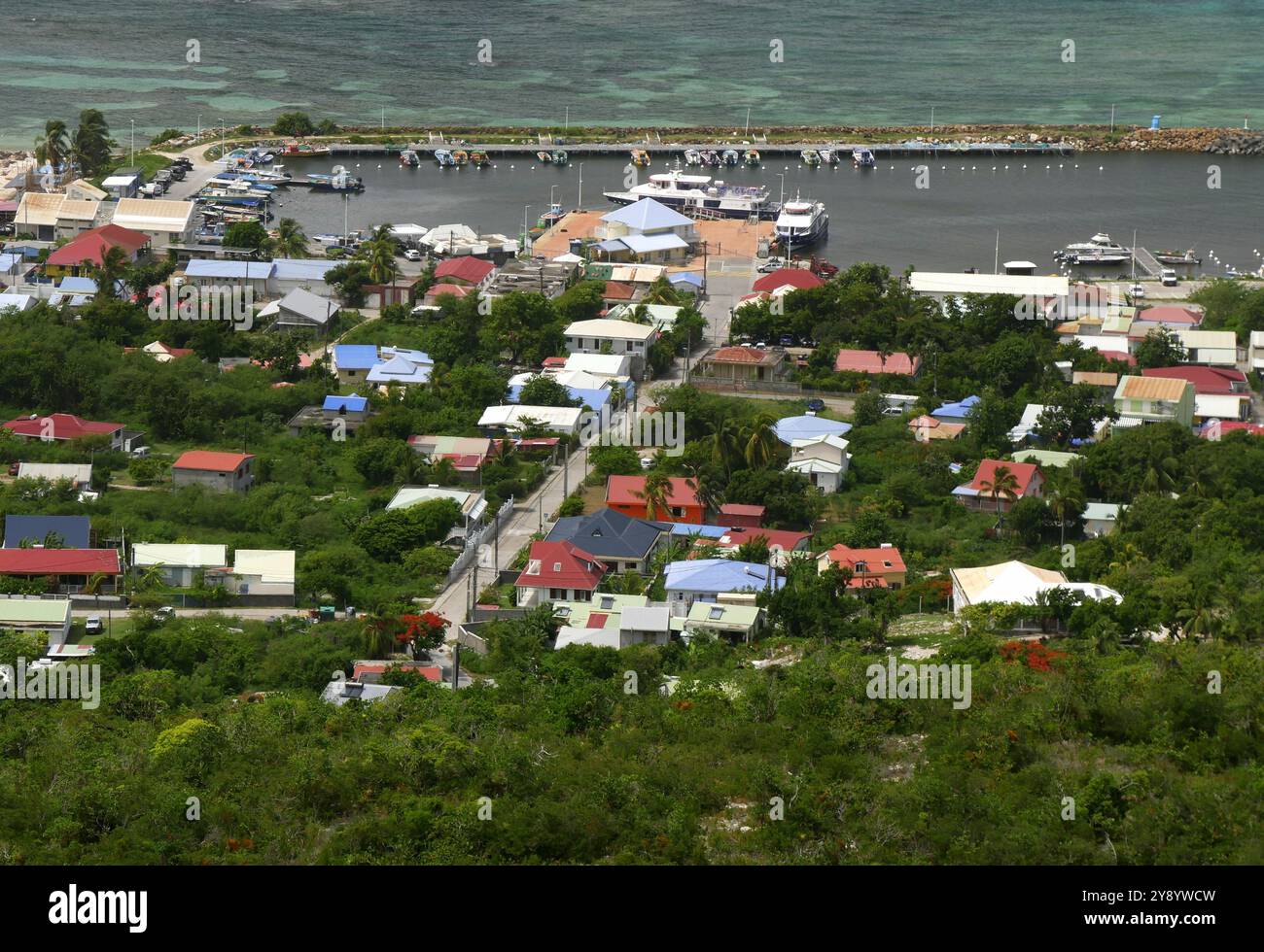 colorful roofs of creole houses and port of Beausejour in la Desirade ...