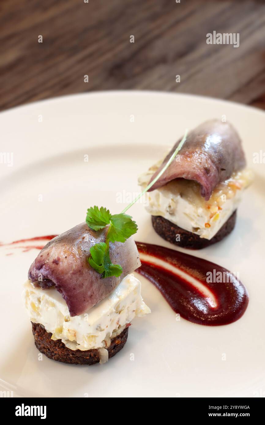 Gourmet pickled herring appetizer at fine dining Polish restaurant ...