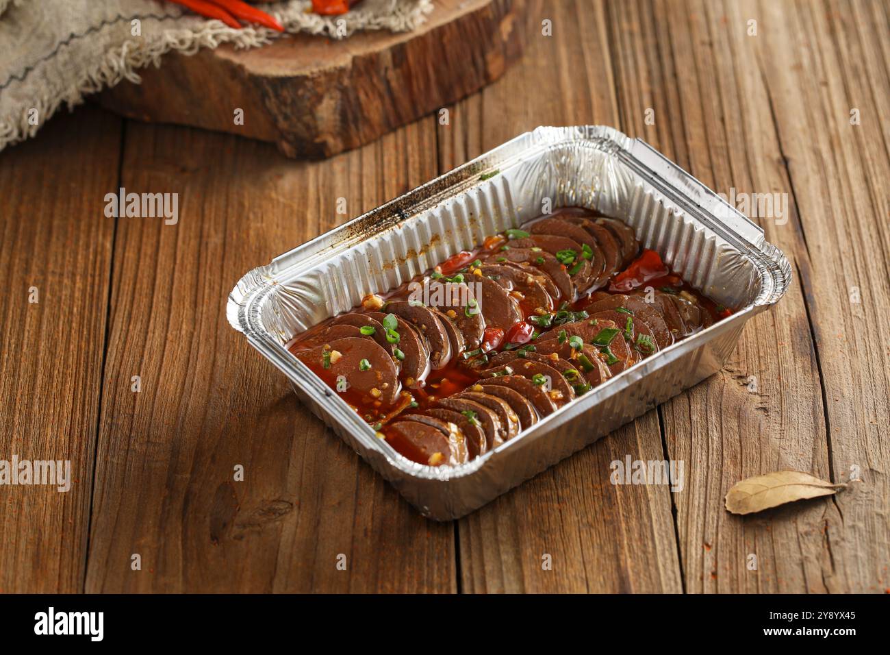 Baked duck blood in Tin Foil box Stock Photo - Alamy