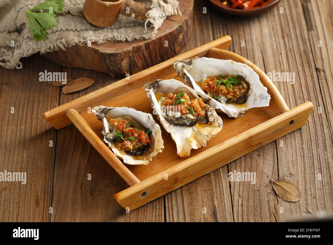 Grilled oysters with Garlic.Japanese grilled oyster barbecue outside ...