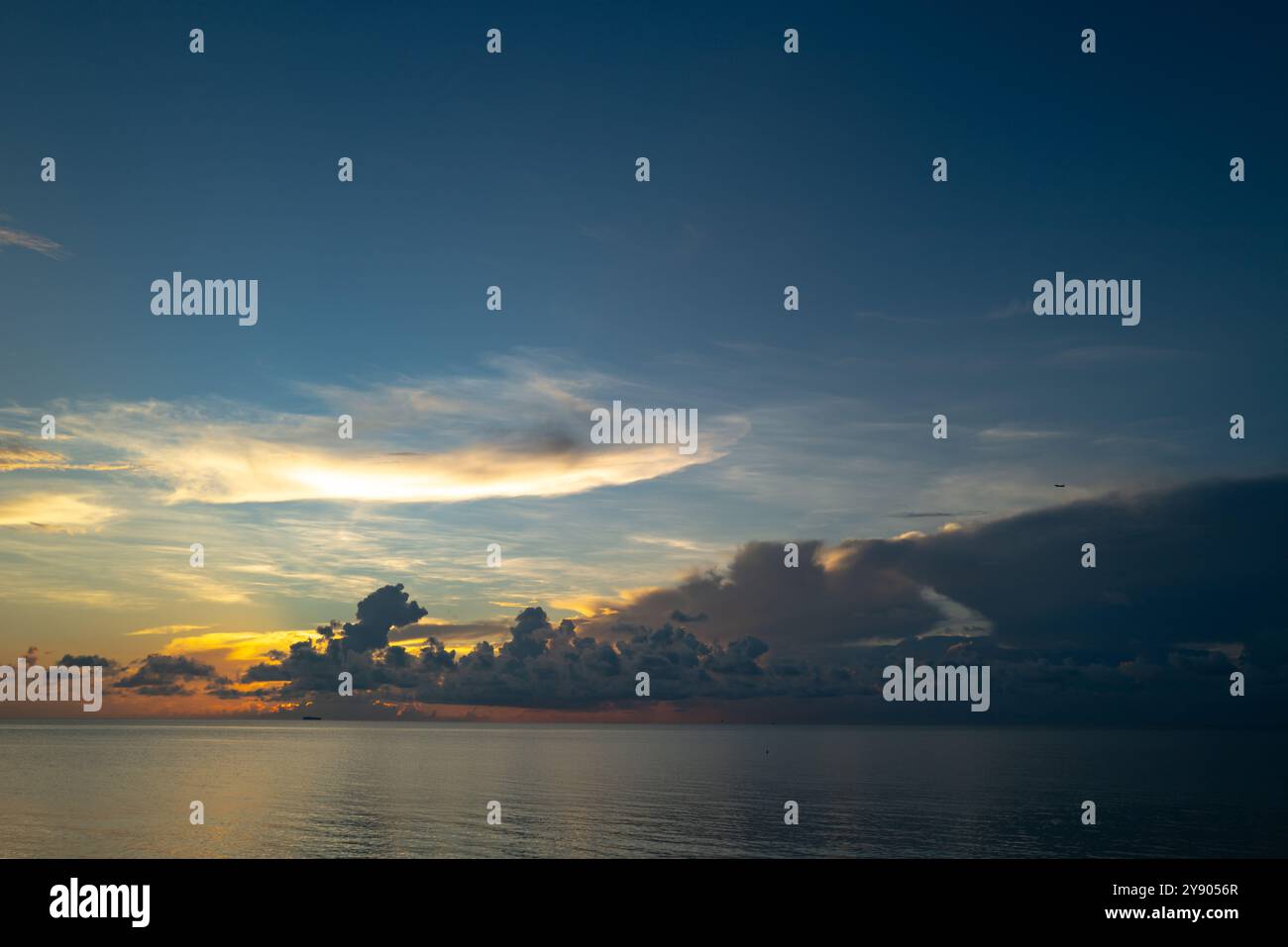 Dramatic sunset sky. sea. Calm sea with sunset sky through the clouds over. Sunset ocean and sky ...