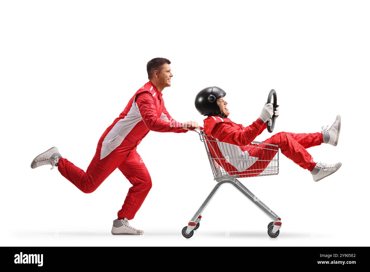 Young car racer running and pushing a mature car racer inside a ...