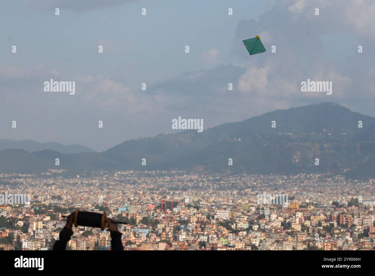People fly kites at the hill near capital during the Dashain festival ...