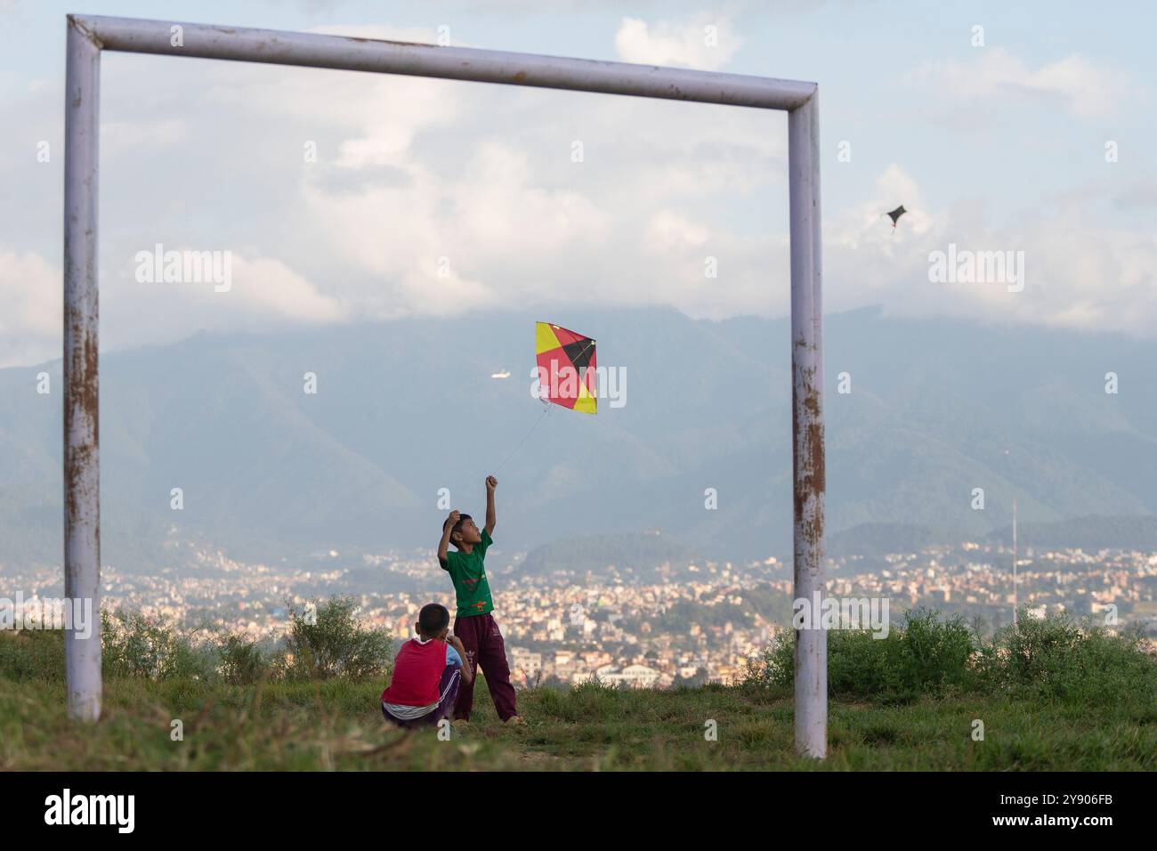 People fly kites at the hill near capital during the Dashain festival ...