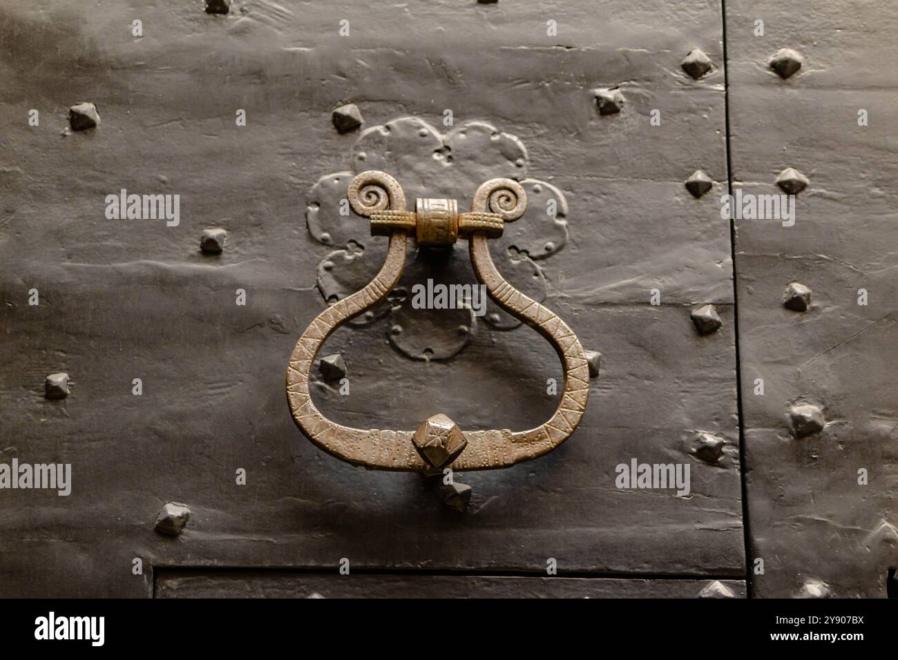 Old wrought iron lock, on a wooden door from the medieval period Stock ...