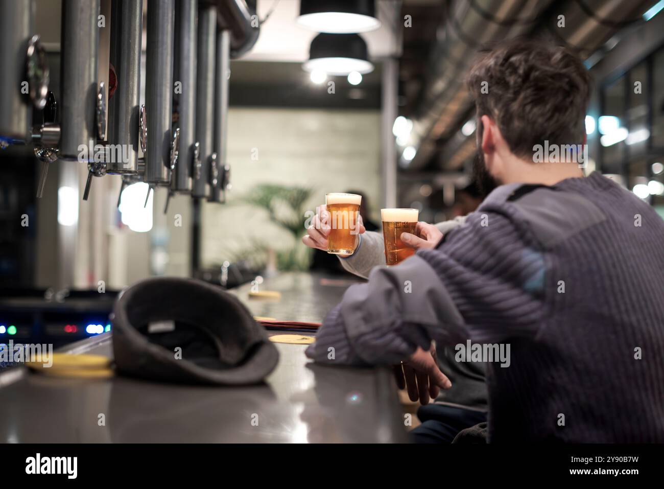 White wine glasses and beers for an aperitif in a night out cocktail ...