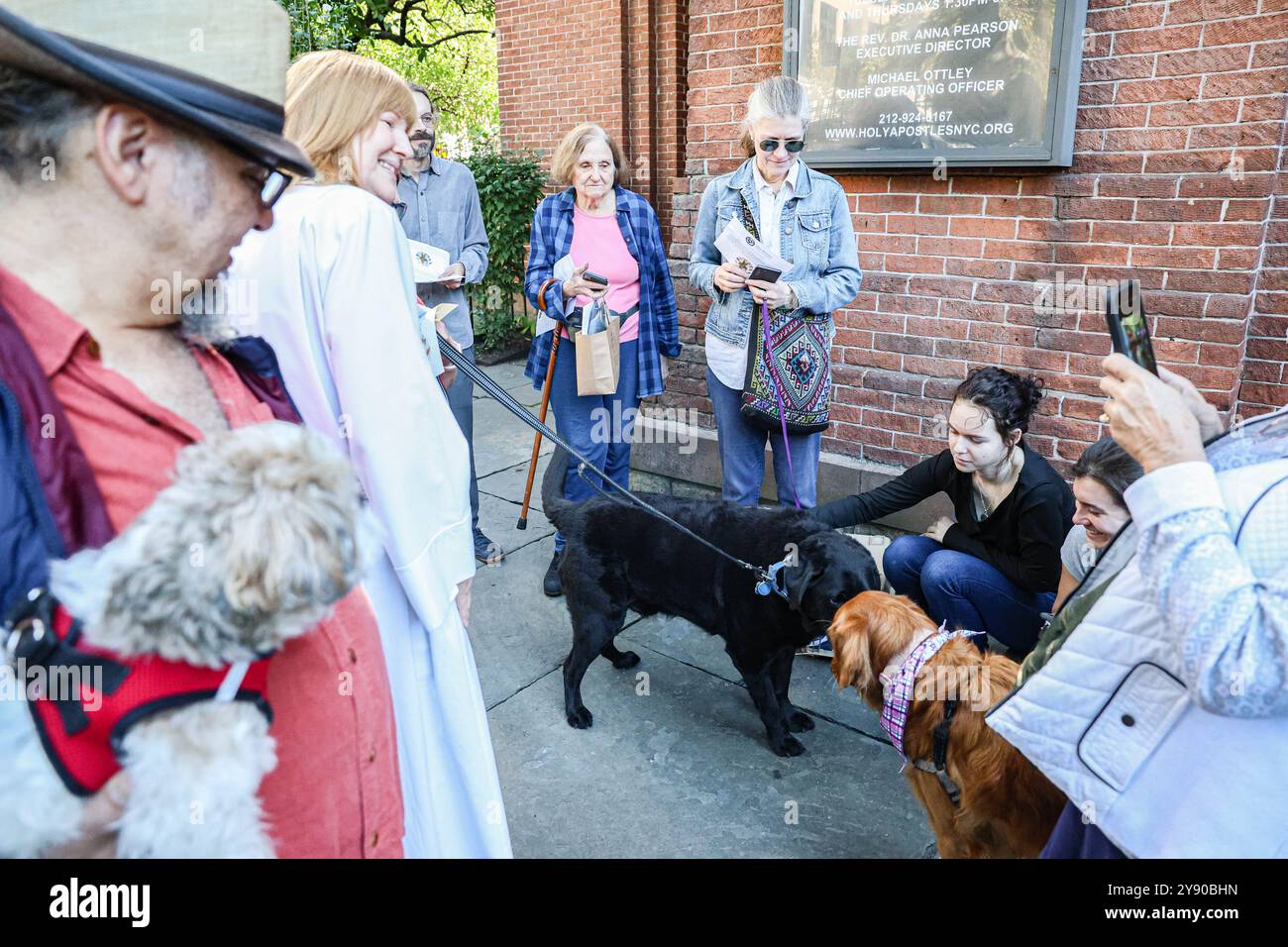 New York, New York, USA. 6th Oct, 2024. A female priest speaks to ...