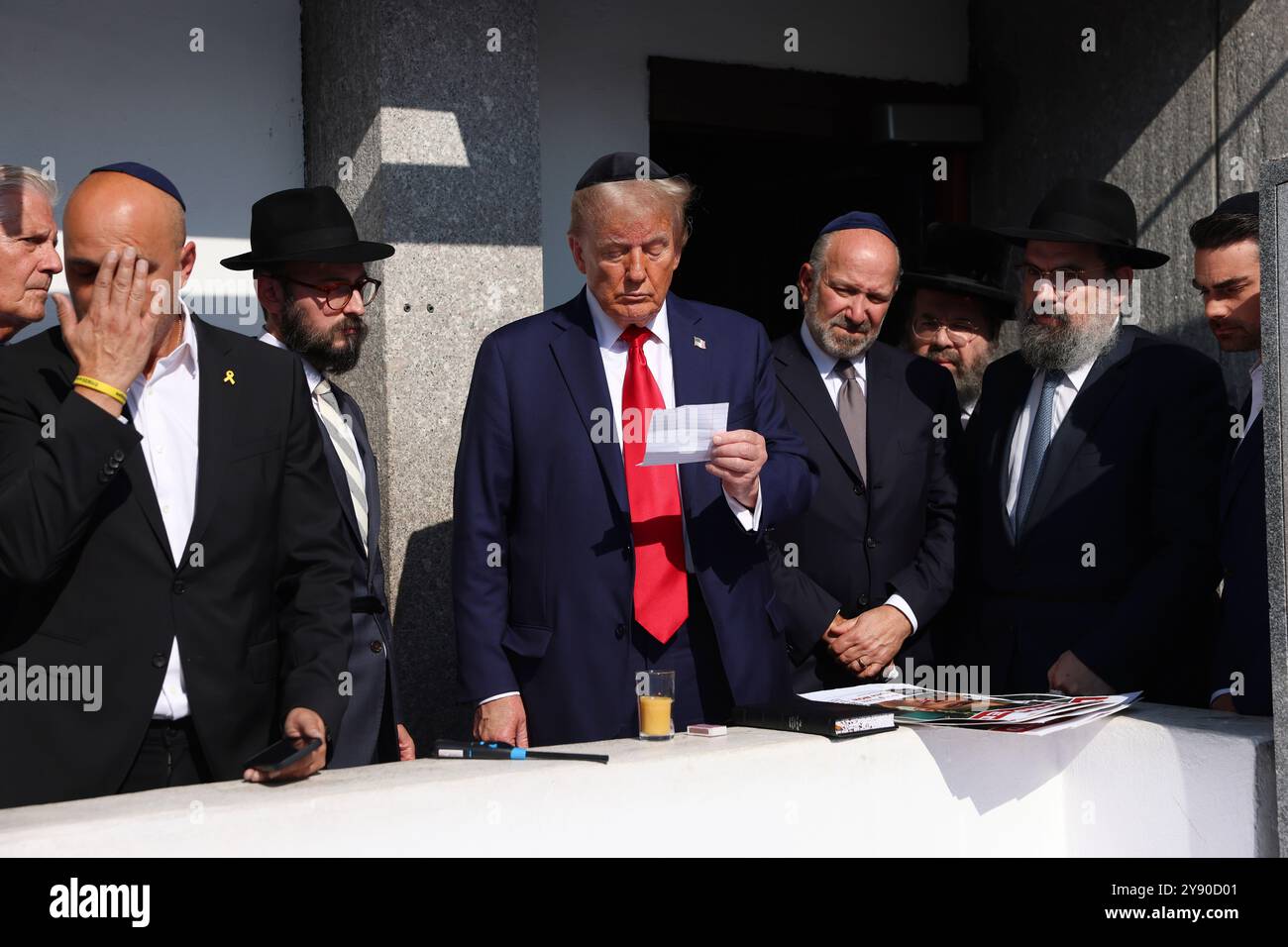 Republican presidential nominee former President Donald Trump, center ...