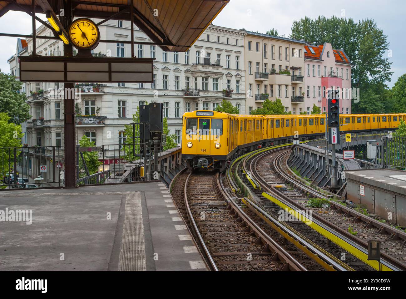 Berlin, Germany 30 May 2009. Yellow Berlin subway on a bridge above ground above the streets ...