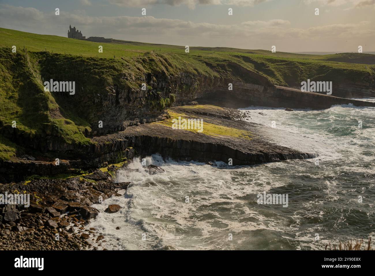 The photograph captures the rugged coastline of Mullaghmore Head with ...