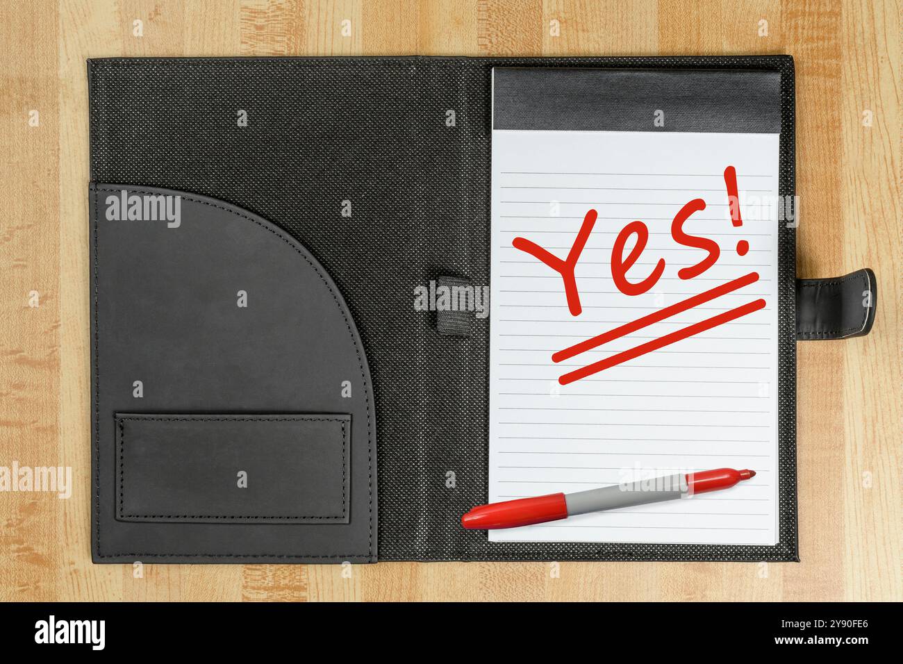 Horizontal shot of a junior legal pad with YES written and underlined ...