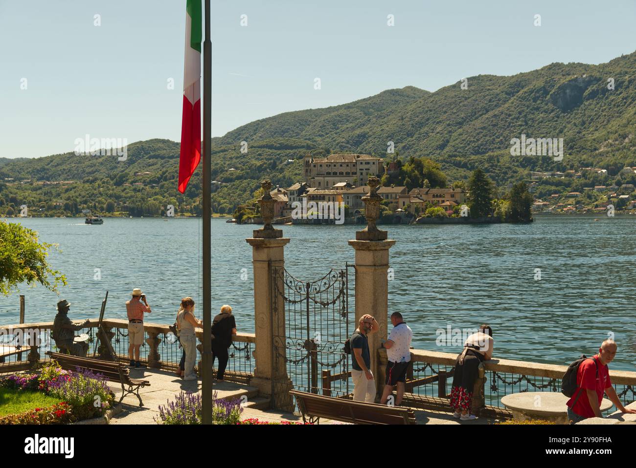 Lake Orta, Italy - 21 Aug 2022: a city park with a view of San Giulio ...