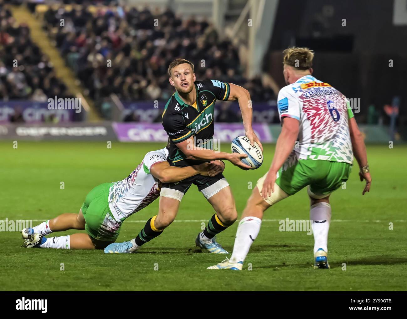 Oscar Beard of Harlequins tackles Rory Hutchinson of Northampton Saints ...