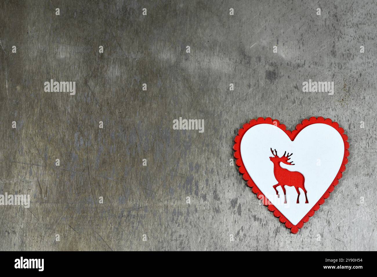 Christmas heart ornament with Christmas reindeer silhouette on grunge ...