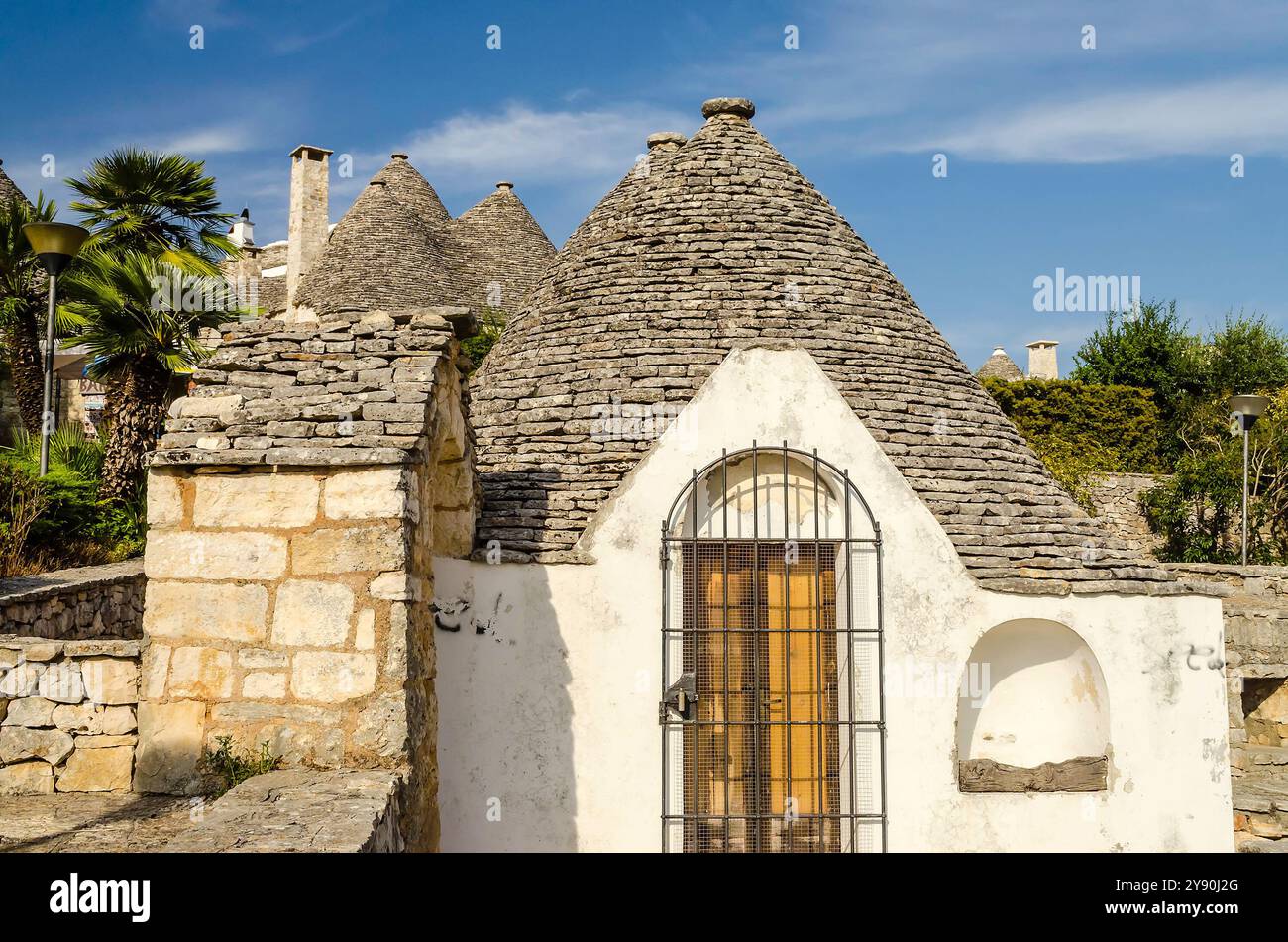 Typical trulli buildings with conical roofs in Alberobello, Apulia ...